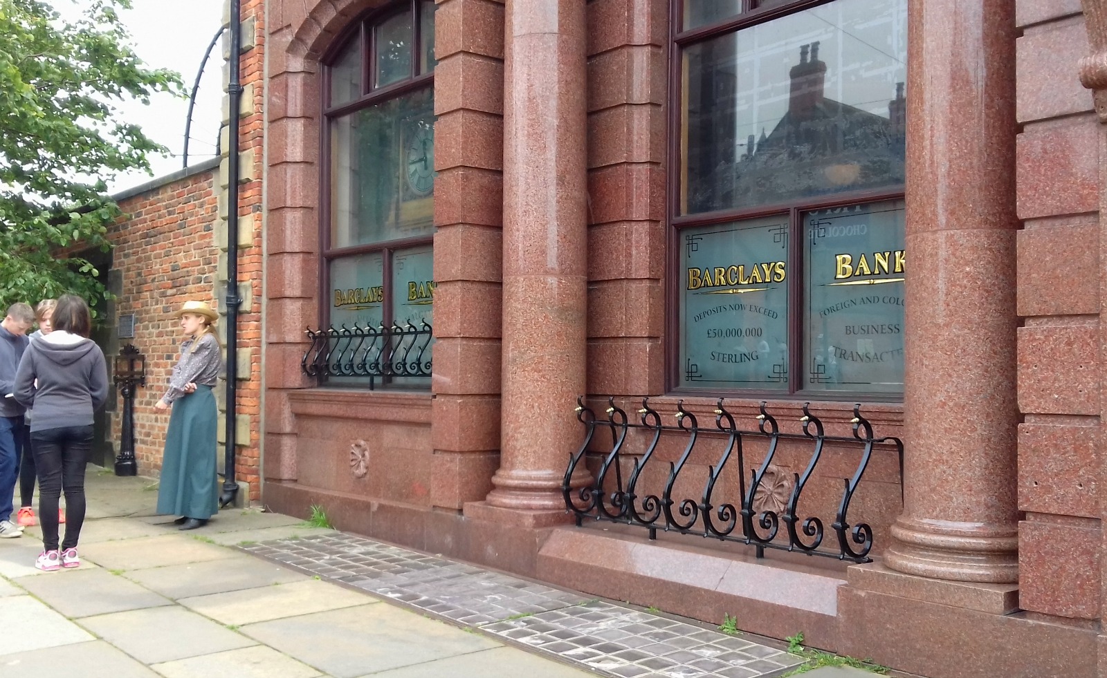 Red granite exterior of Barclays Bank – Millie Thom